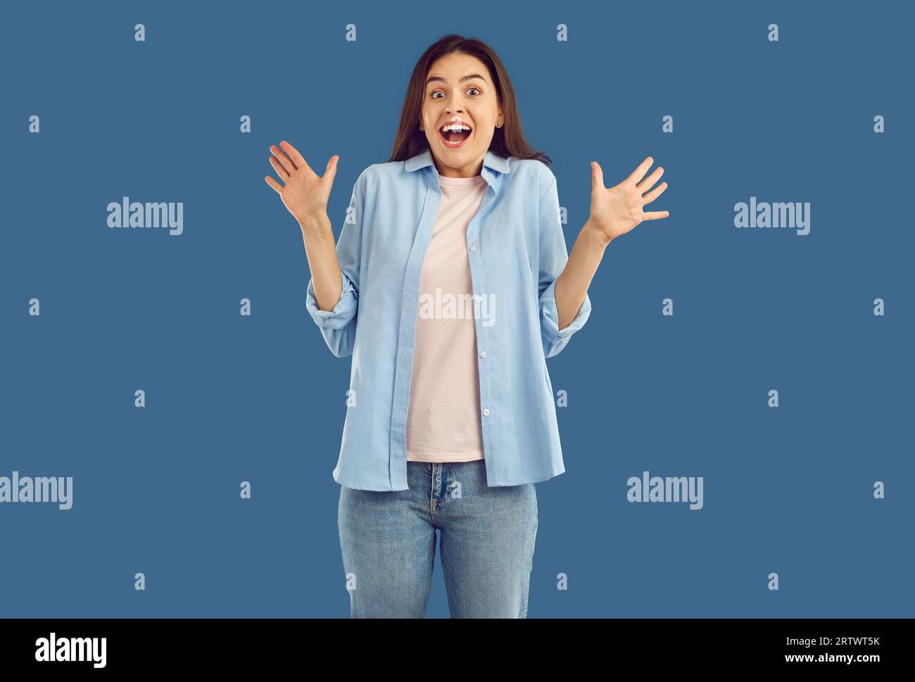 Portrait of very surprised woman looking at camera with shocked but ...