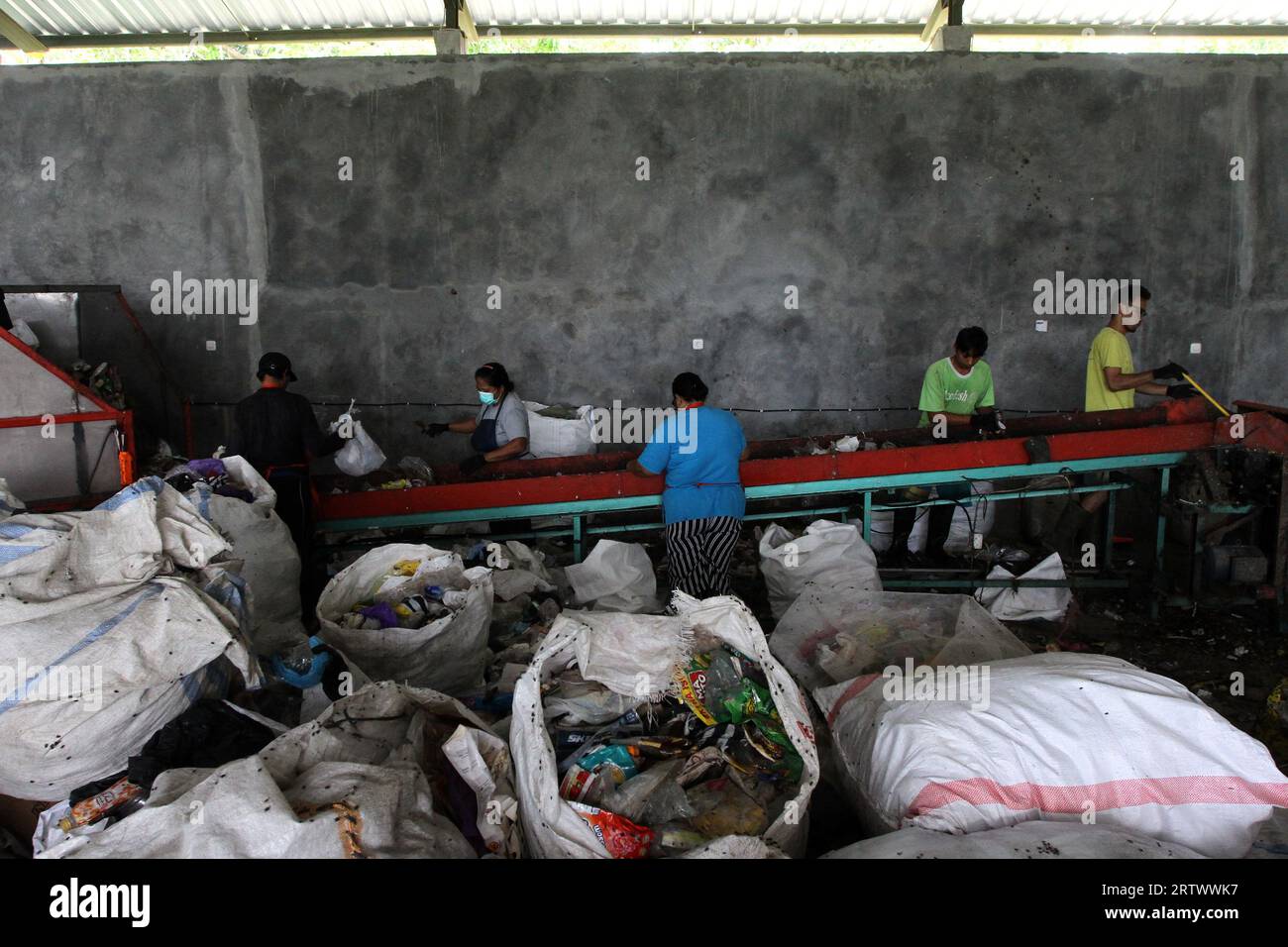 Sleman, Yogyakarta, Indonesia. 15th Sep, 2023. Workers sort waste at ...