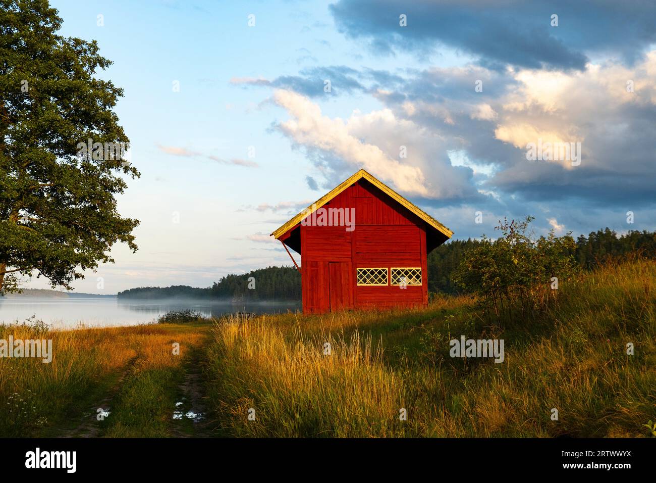 Typical crimson red building in the beautiful nature of Sweden Stock ...