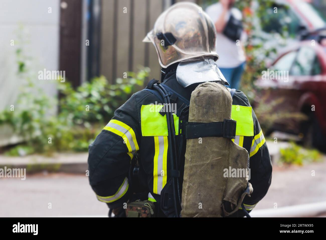 Group of fire men in protective uniform during fire fighting operation ...