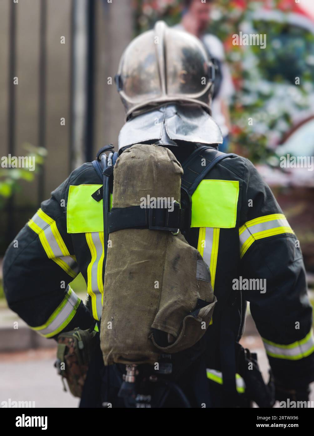 Group of fire men in protective uniform during fire fighting operation ...