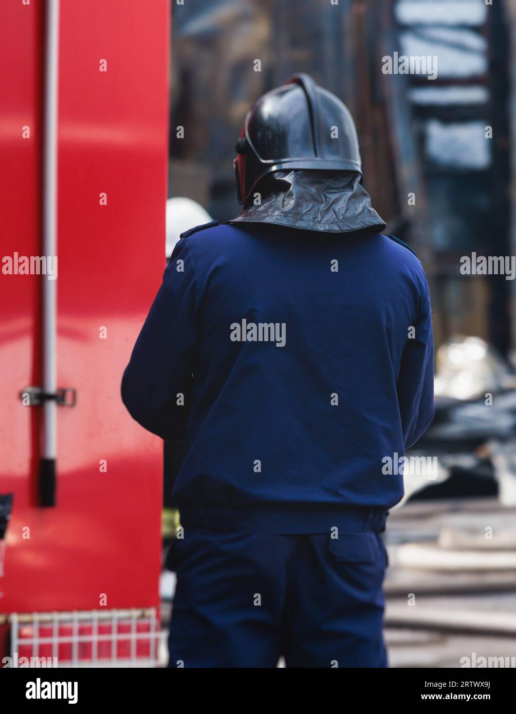 Group of fire men in protective uniform during fire fighting operation ...