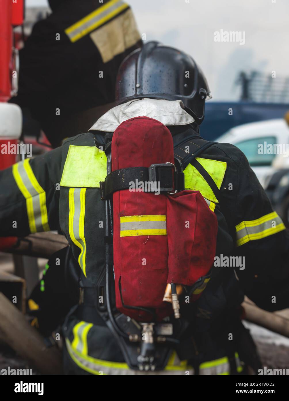 Group of fire men in protective uniform during fire fighting operation ...
