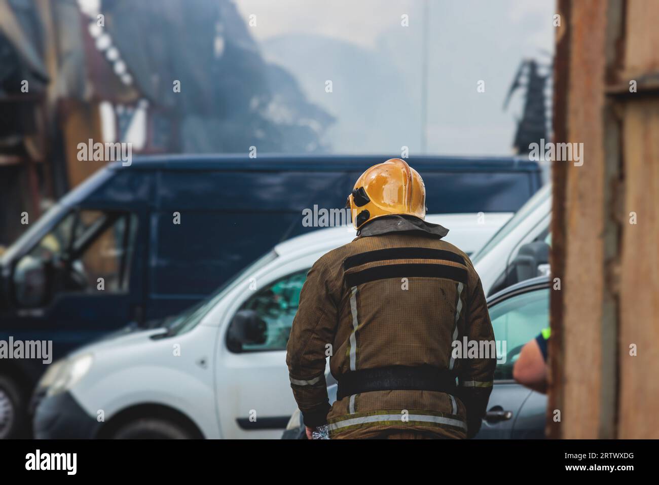 Group of fire men in protective uniform during fire fighting operation ...