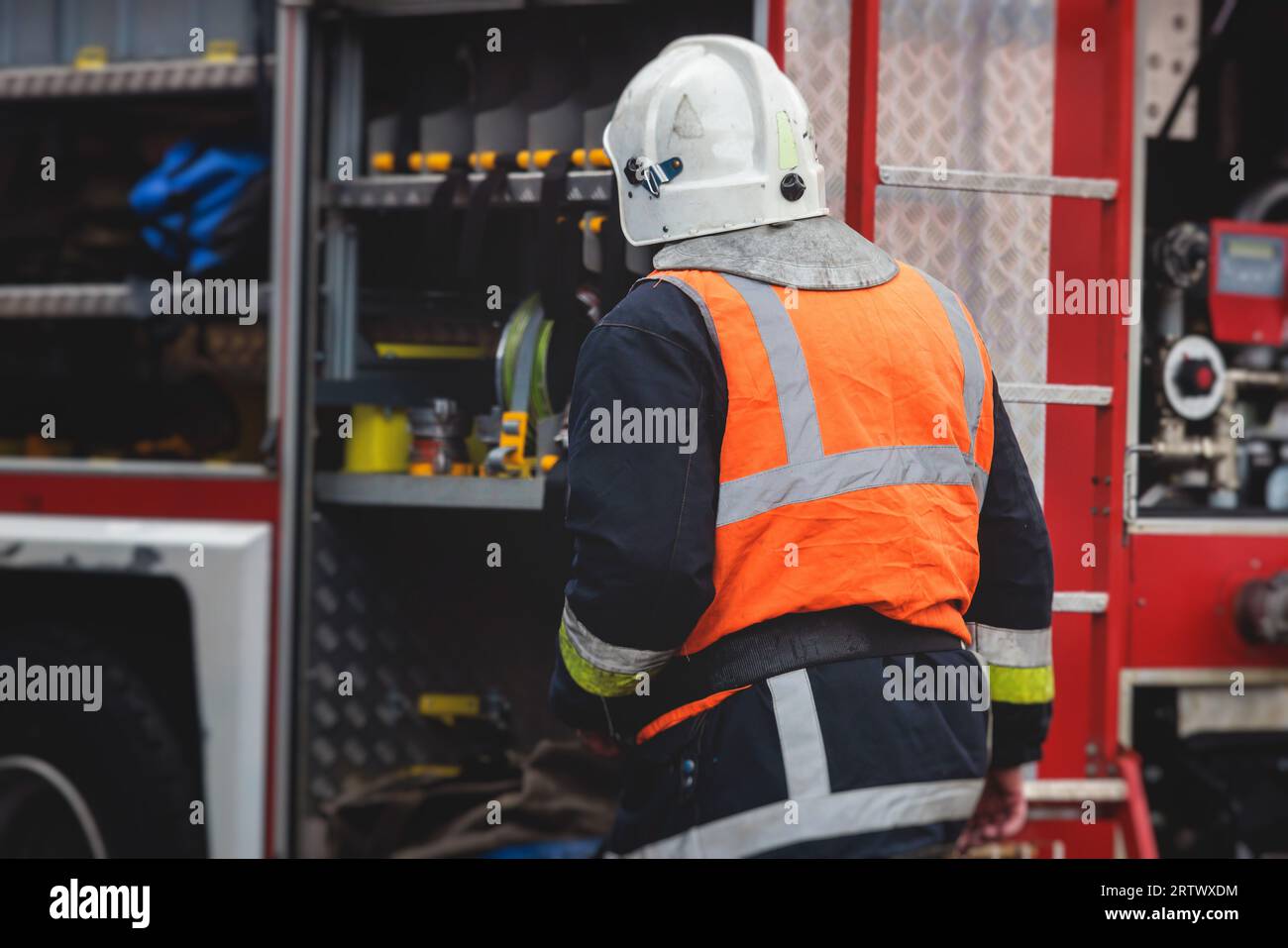 Group of fire men in protective uniform during fire fighting operation ...