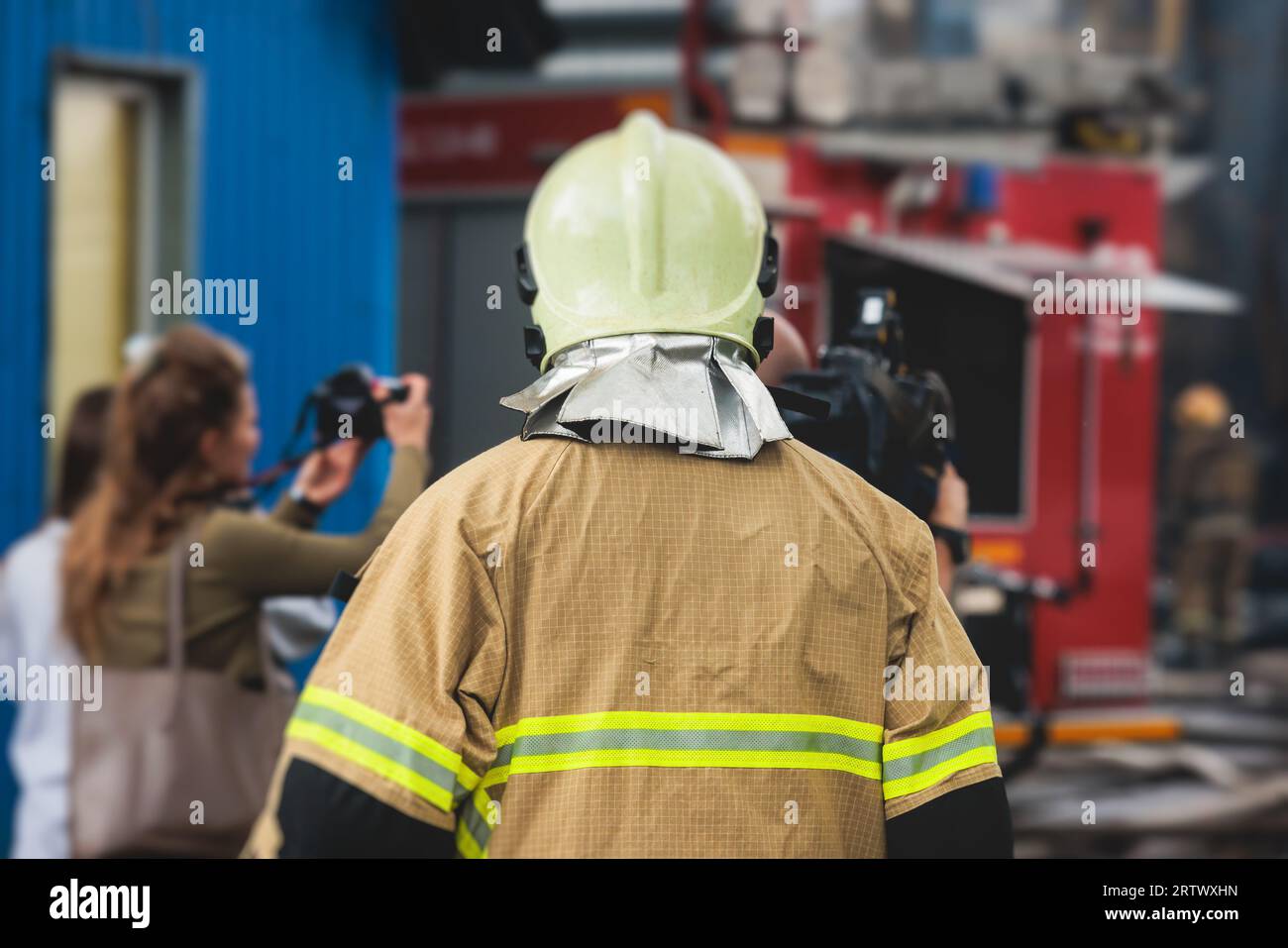 Group of fire men in protective uniform during fire fighting operation ...