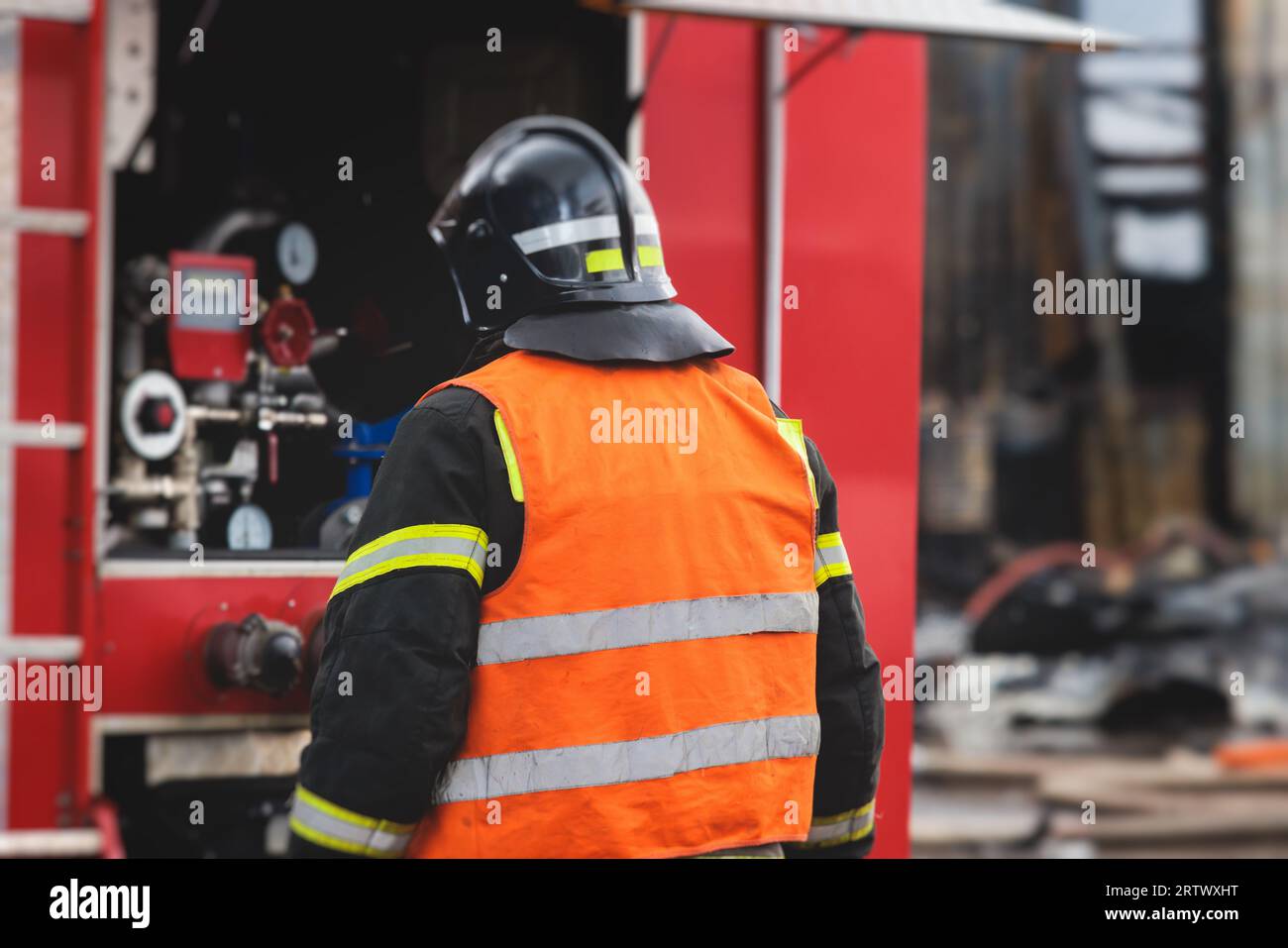 Group of fire men in protective uniform during fire fighting operation ...