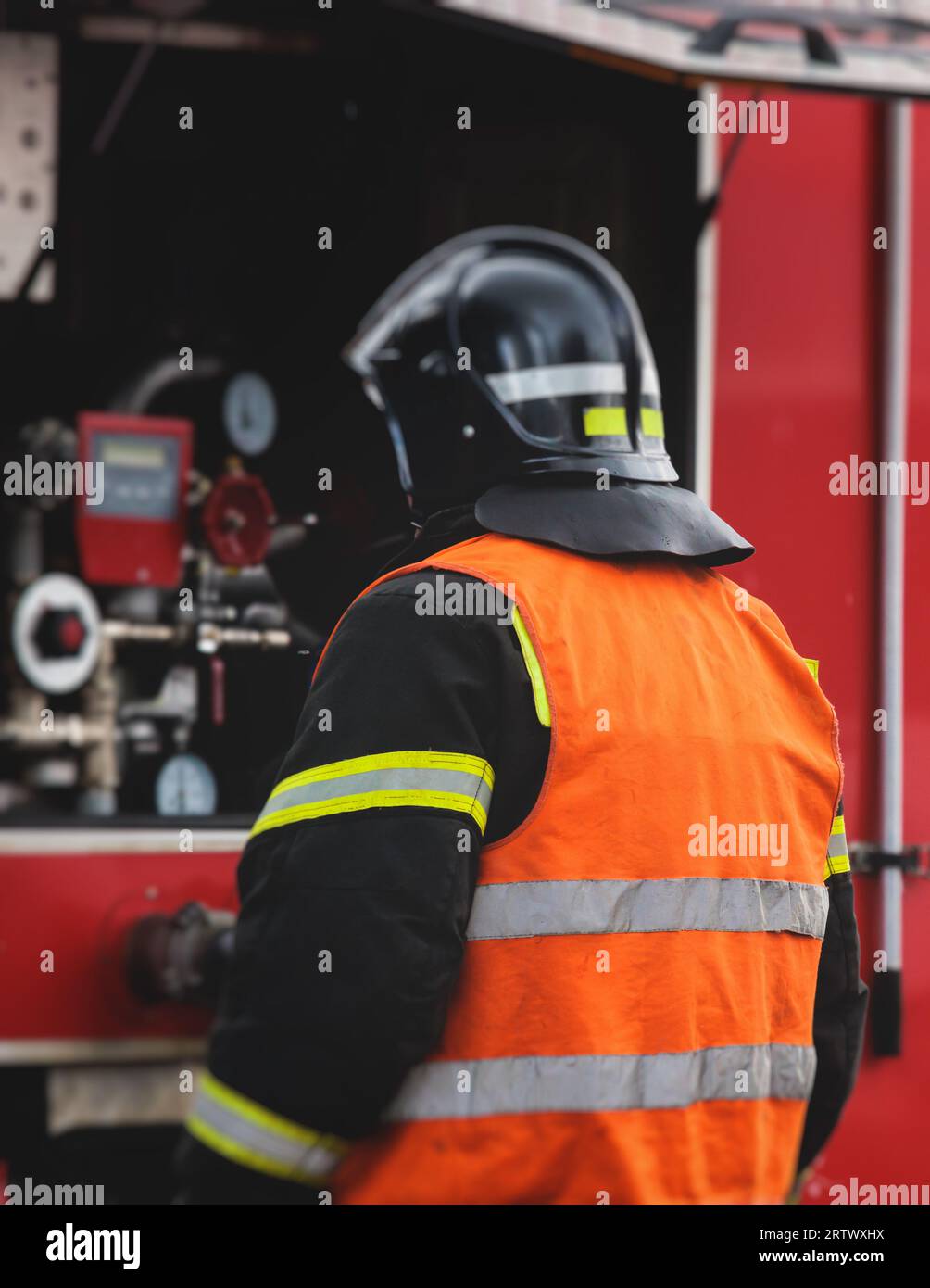 Group of fire men in protective uniform during fire fighting operation ...