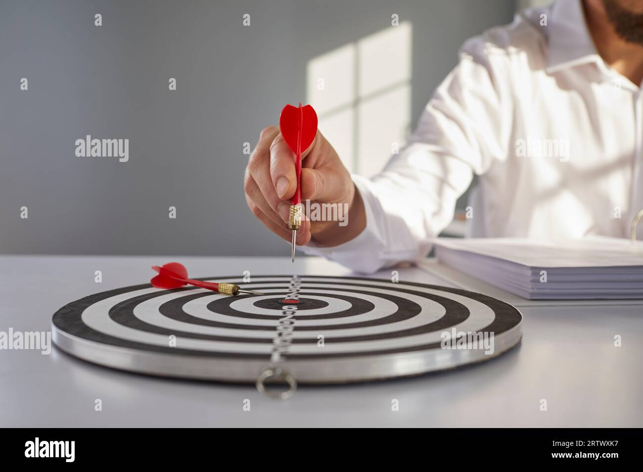 Arrow hits bullseye symbol success hi-res stock photography and images ...