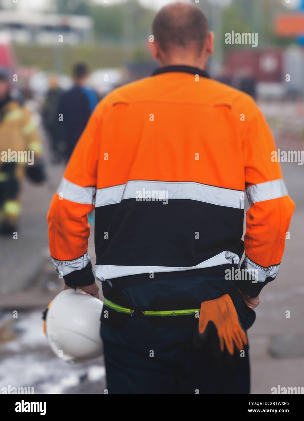 Group of fire men in protective uniform during fire fighting operation ...