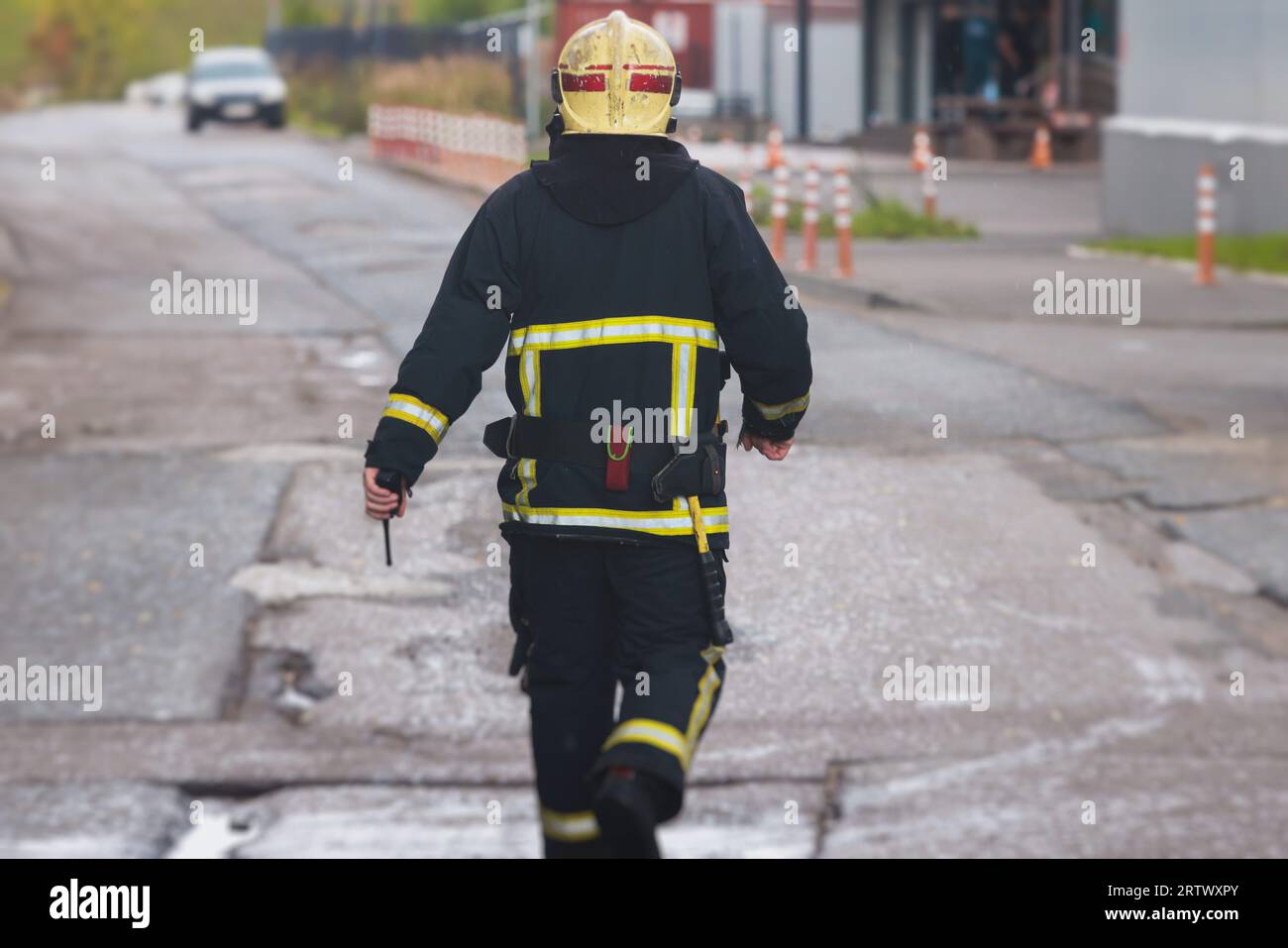 Group of fire men in protective uniform during fire fighting operation ...