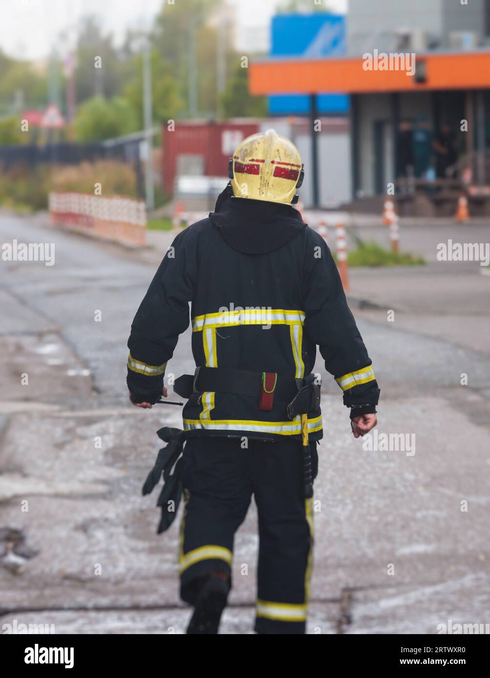 Group of fire men in protective uniform during fire fighting operation ...
