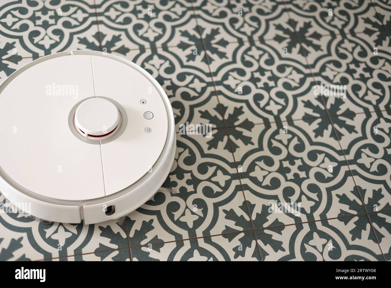 Wireless autonomous smart robotic vacuum cleaner is vacuuming floor ...