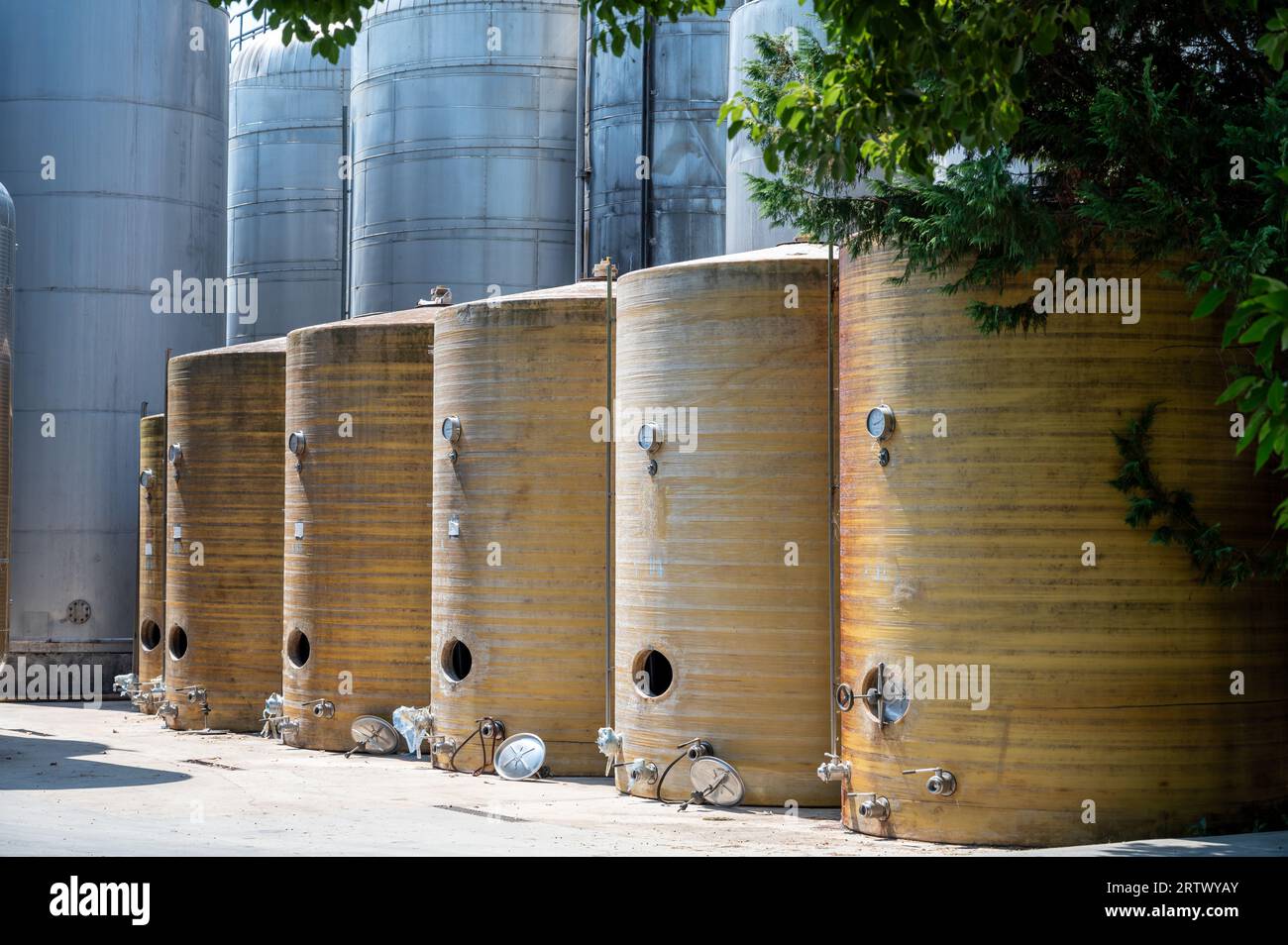 Big outdoor concrete tanks for fermentation of grapes, wine making in ...