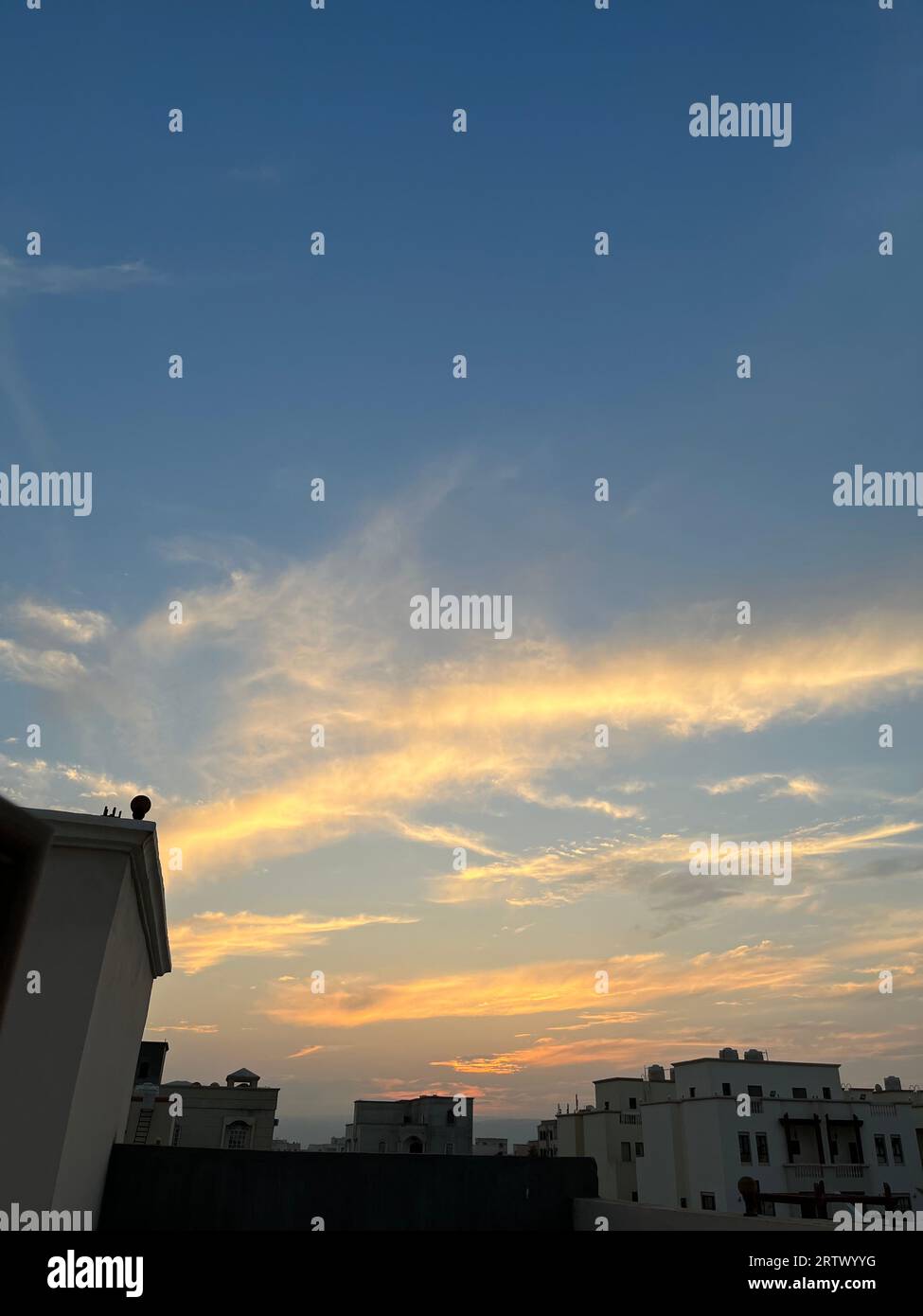 A dramatic orange sunset sky illuminated over the city skyline Stock ...