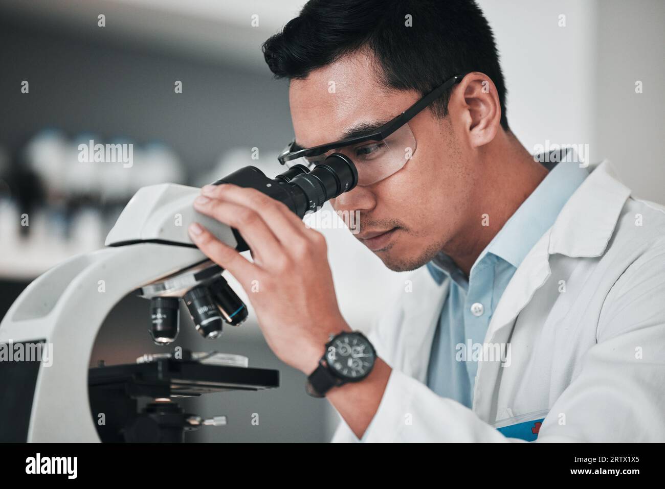 Man, scientist and microscope in forensic science, research or new ...