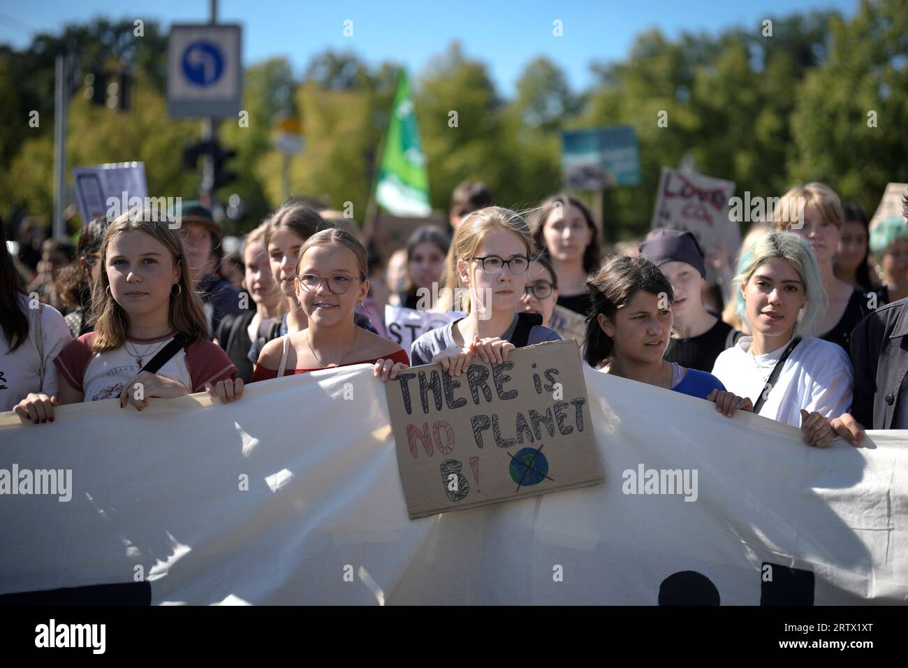 A student holds a poster as she takes part in a Global Climate Strike ...