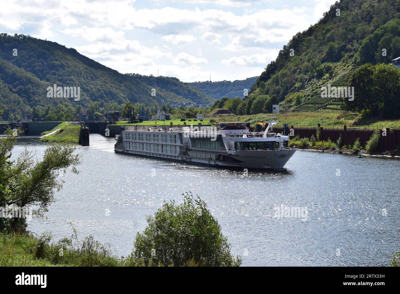 passenger ship leaving a river lock Stock Photo - Alamy
