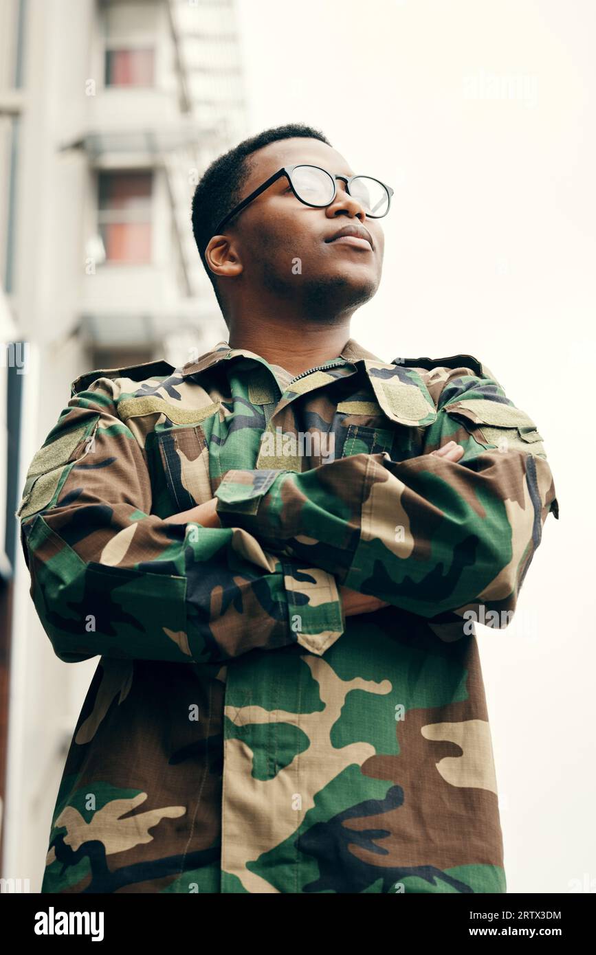 Thinking, outdoor and black man with arms crossed, soldier and ...