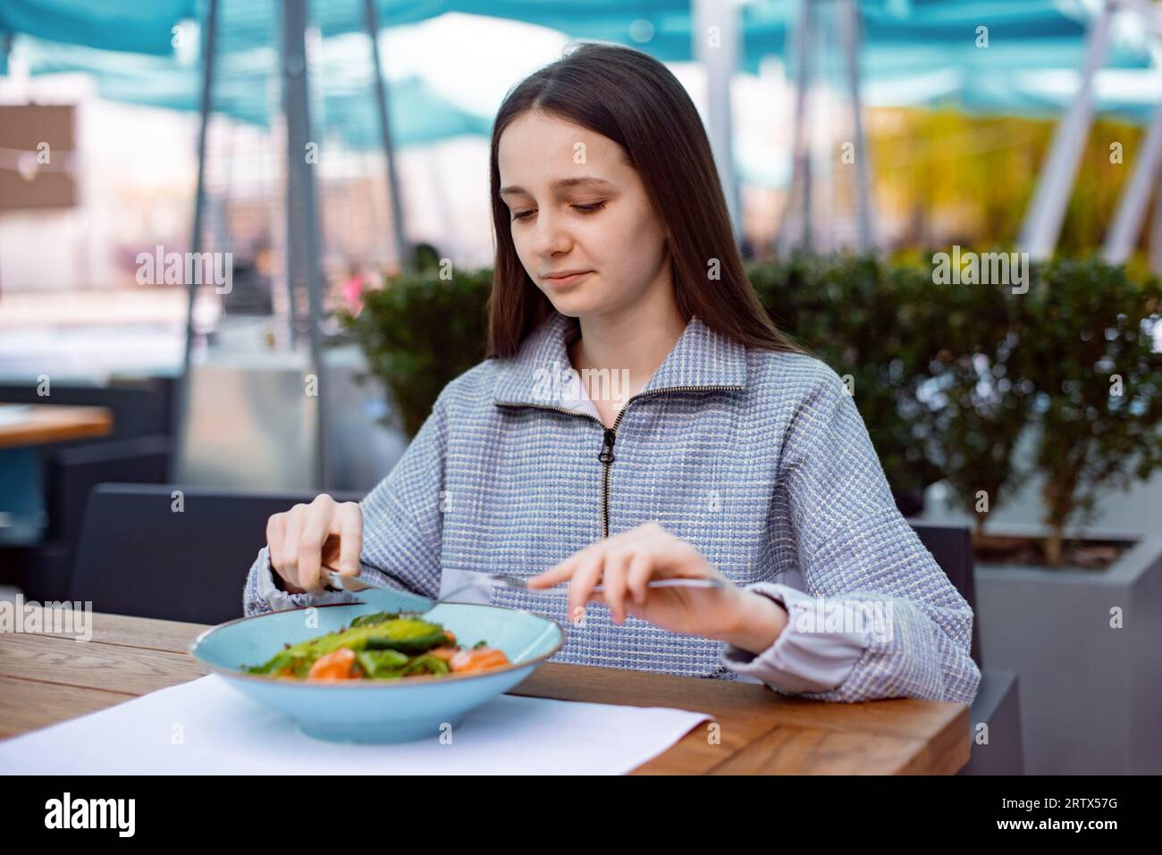healthy break with avocado green salad for teenager sport girl in ...