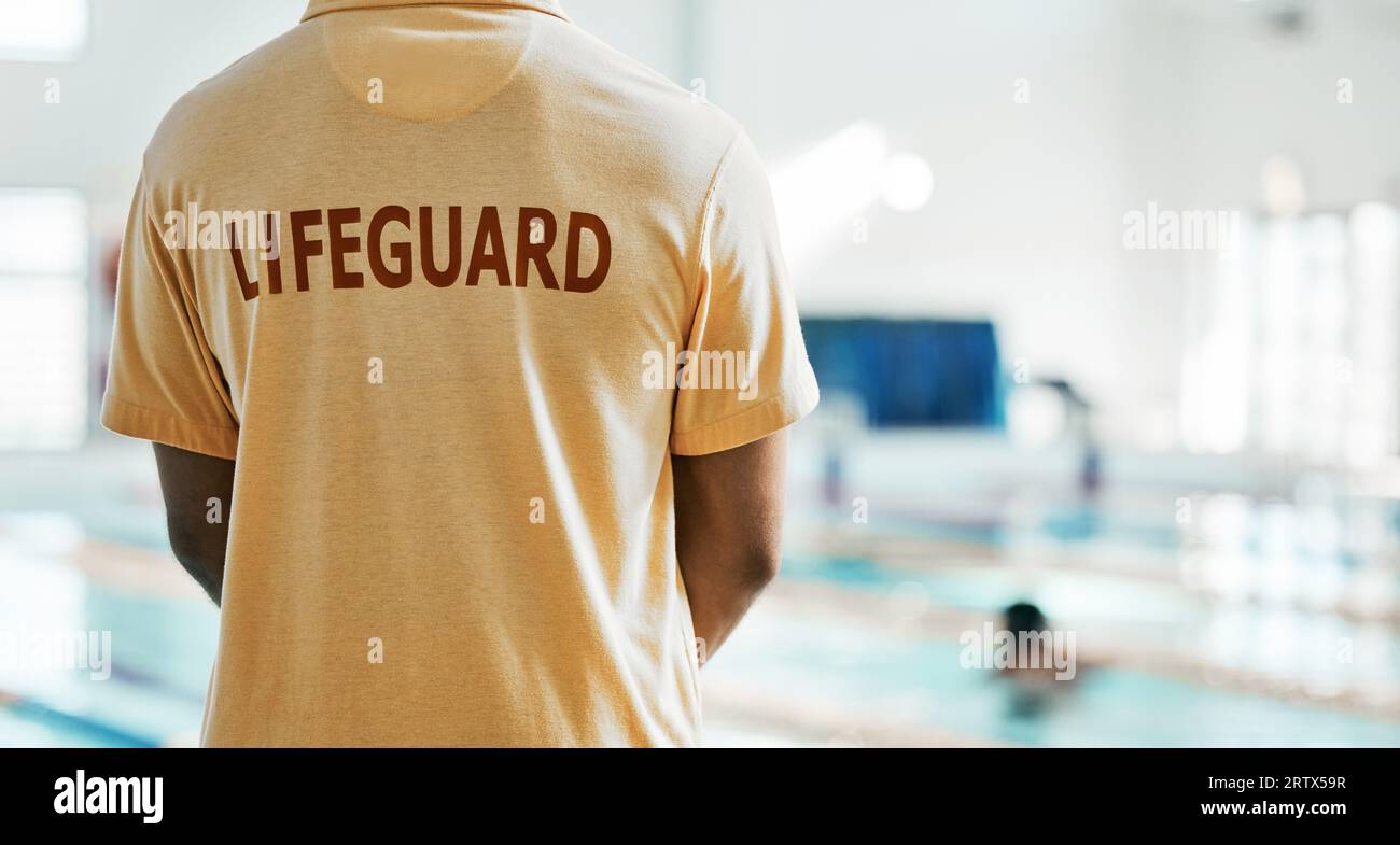 Lifeguard safety, swimming pool and back of person ready for job ...