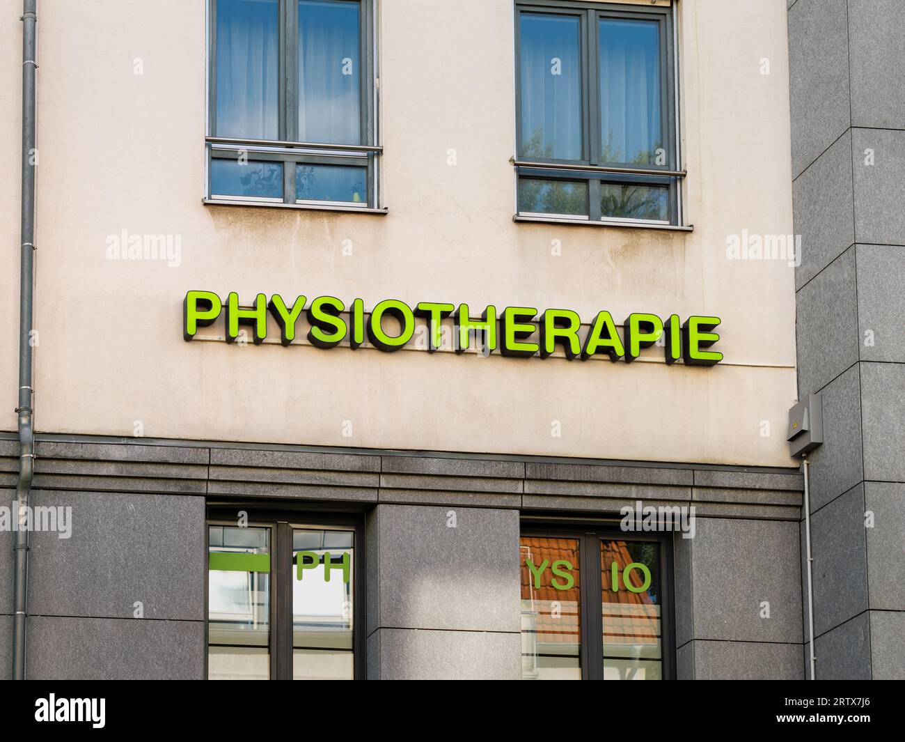 Physiotherapie (physiotherapy) lettering on a building facade. The ...