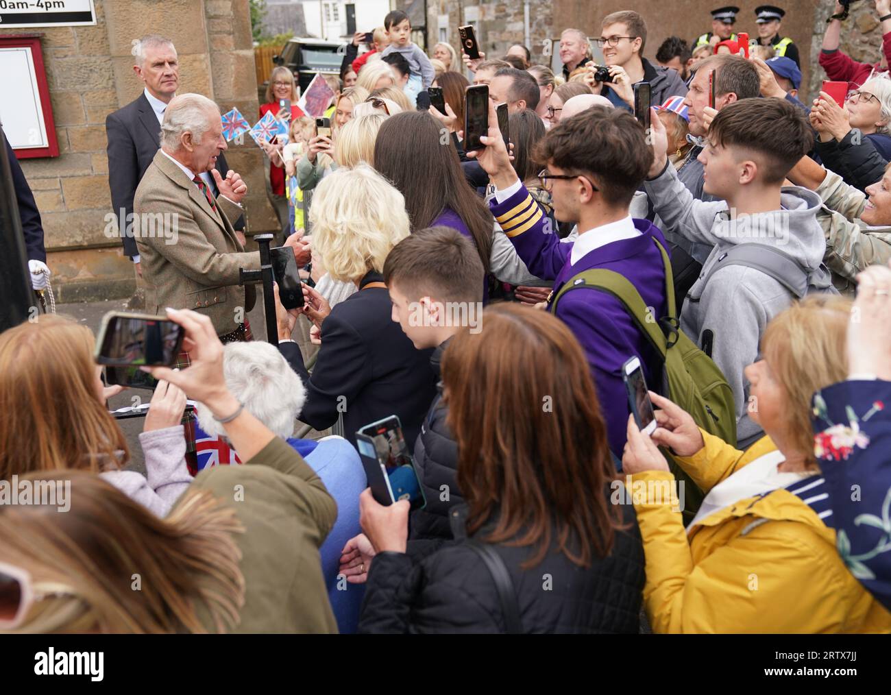 King Charles III speaks to members of the public during a walkabout in ...