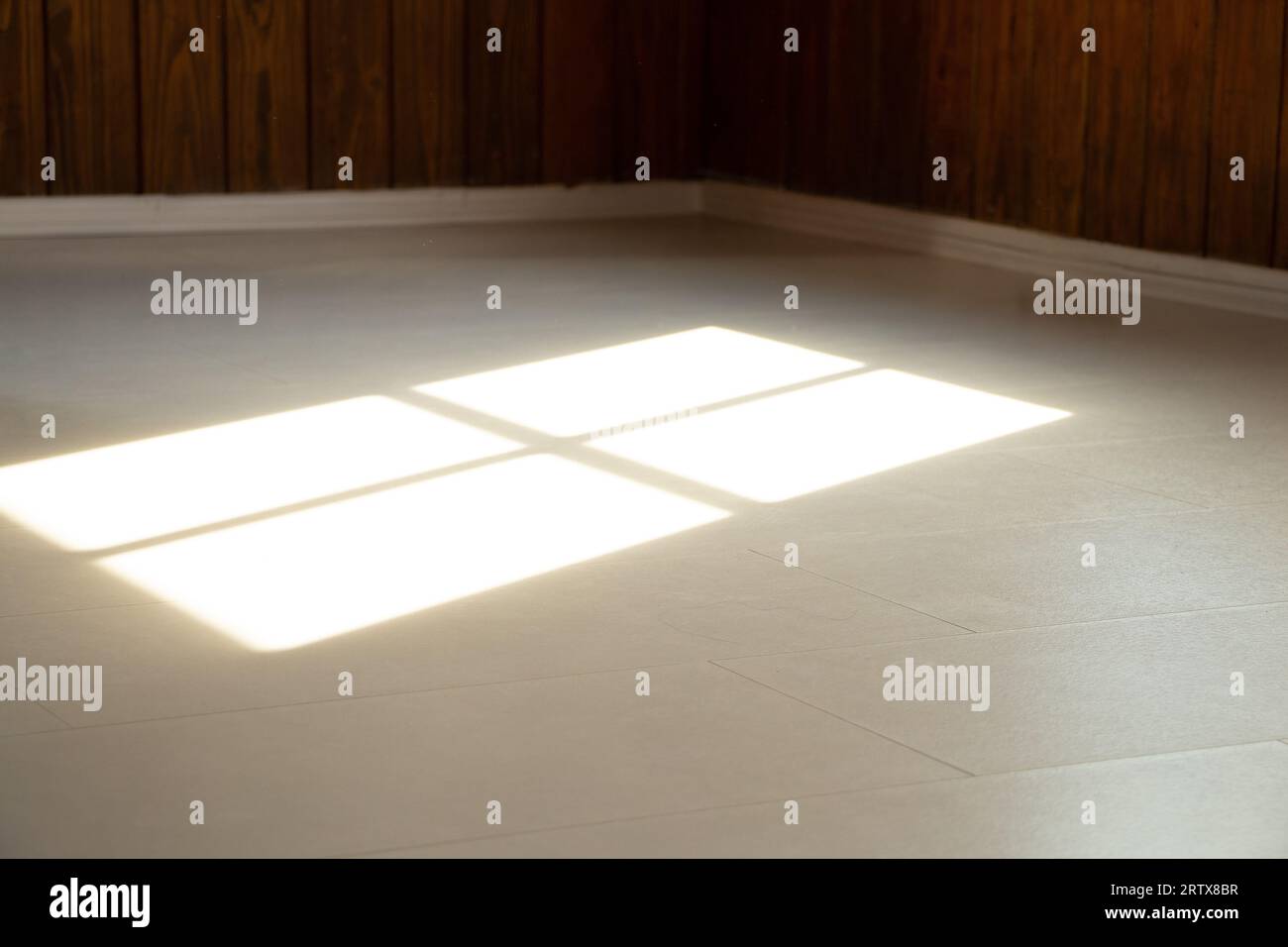 Shadow and light from a window on the floor of a house, sunlight and ...