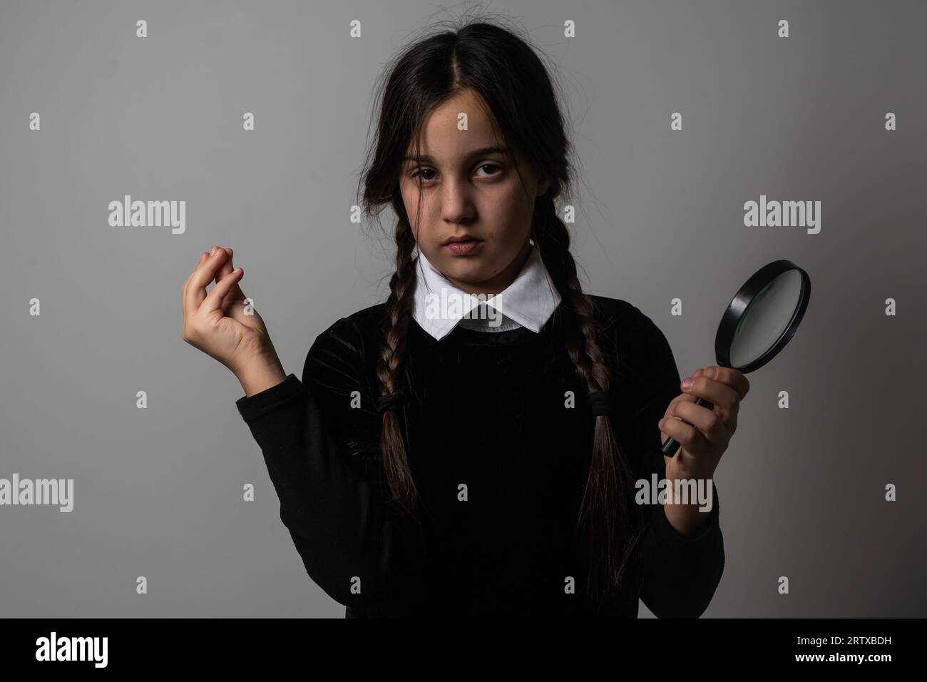 Wednesday Addams. Angry girl student Stock Photo - Alamy
