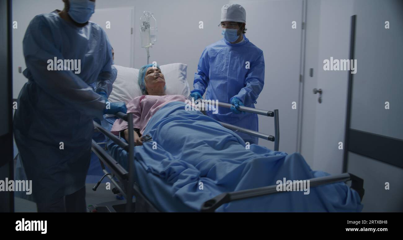 Doctors, nurses and paramedics push stretcher with sick patient to ...