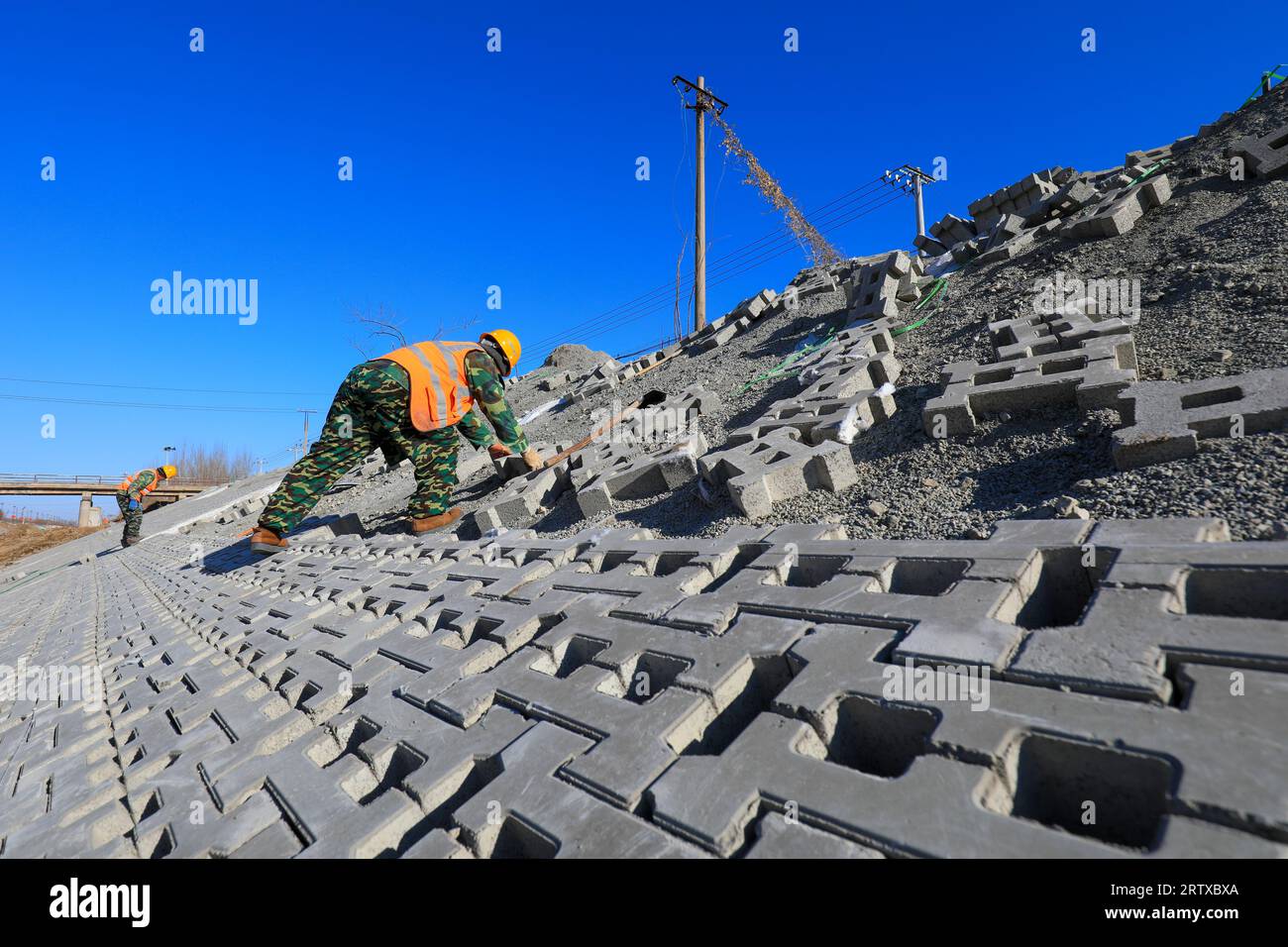 Tangshan, China - December 24, 2021:Workers are building river slope ...