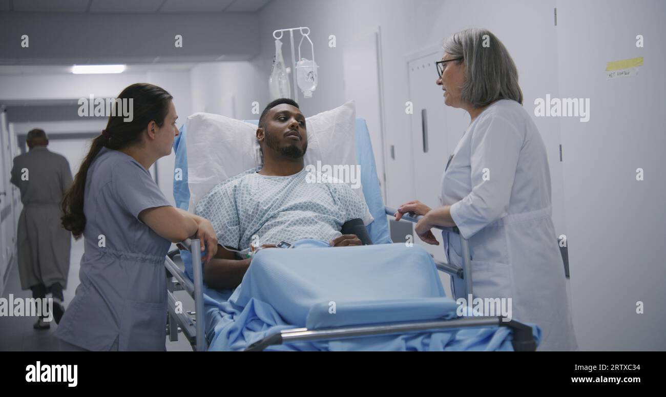 Doctor consults man before hi-res stock photography and images - Alamy