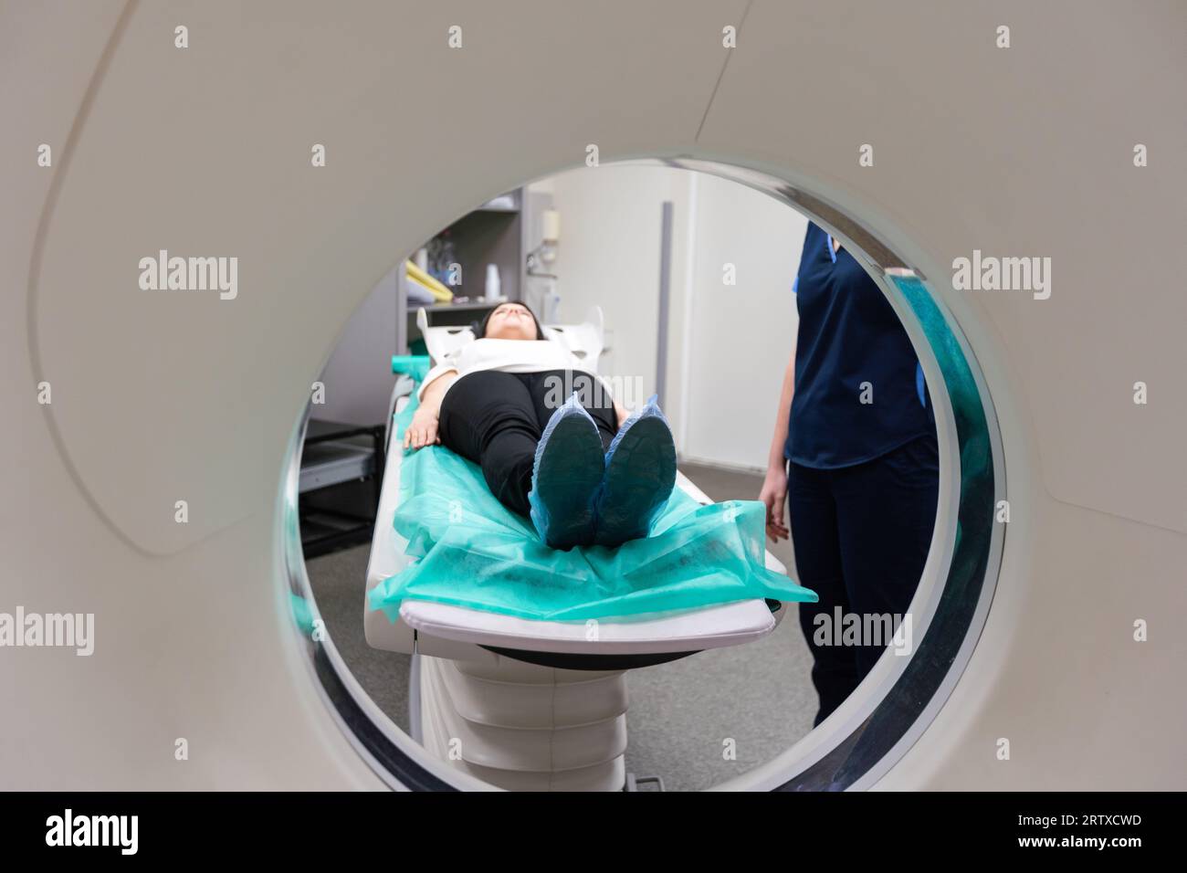 Radiologic technician and Patient being scanned and diagnosed on ...