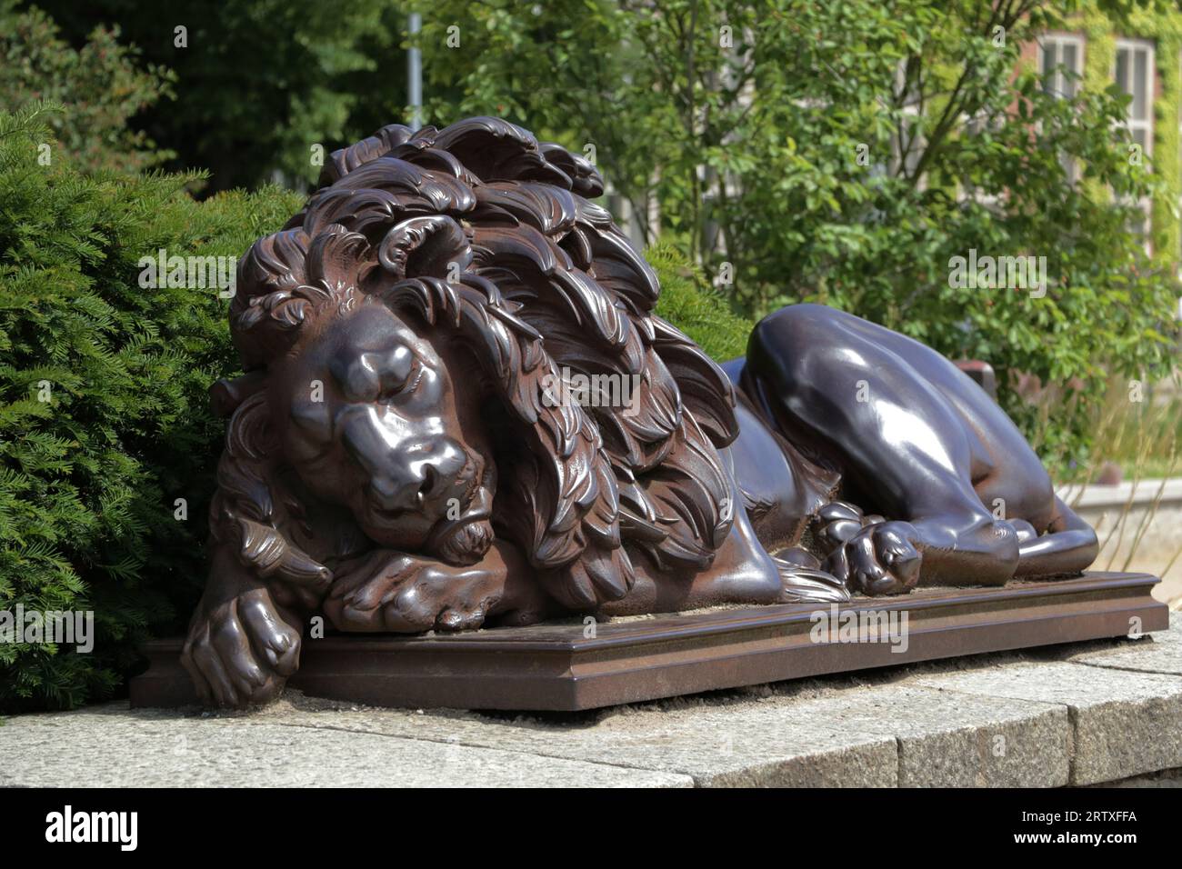 Statue of sleeping lion securing the entrance to the main city square ...