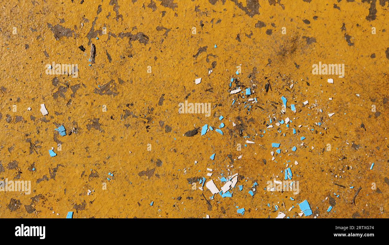 flaky surface of bright orange color interspersed with sharp blue spots ...