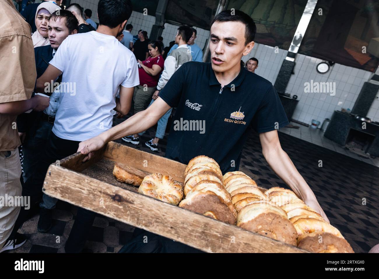 Tashkent, Uzbekistan. 14th Sep, 2023. A staff member carries a tray of ...