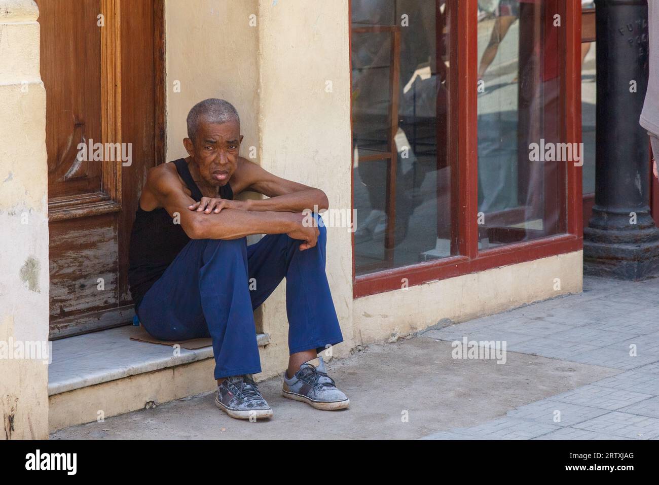 Man sits on doorstep hi-res stock photography and images - Alamy