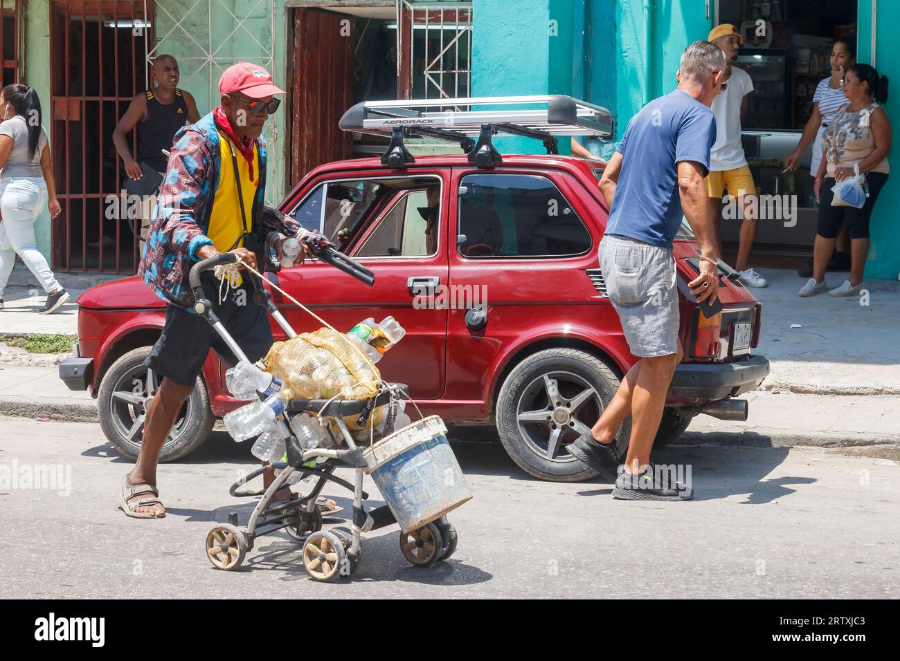 Havana, Cuba, 2023, A Cuban man uses a baby carriage to move diverse ...