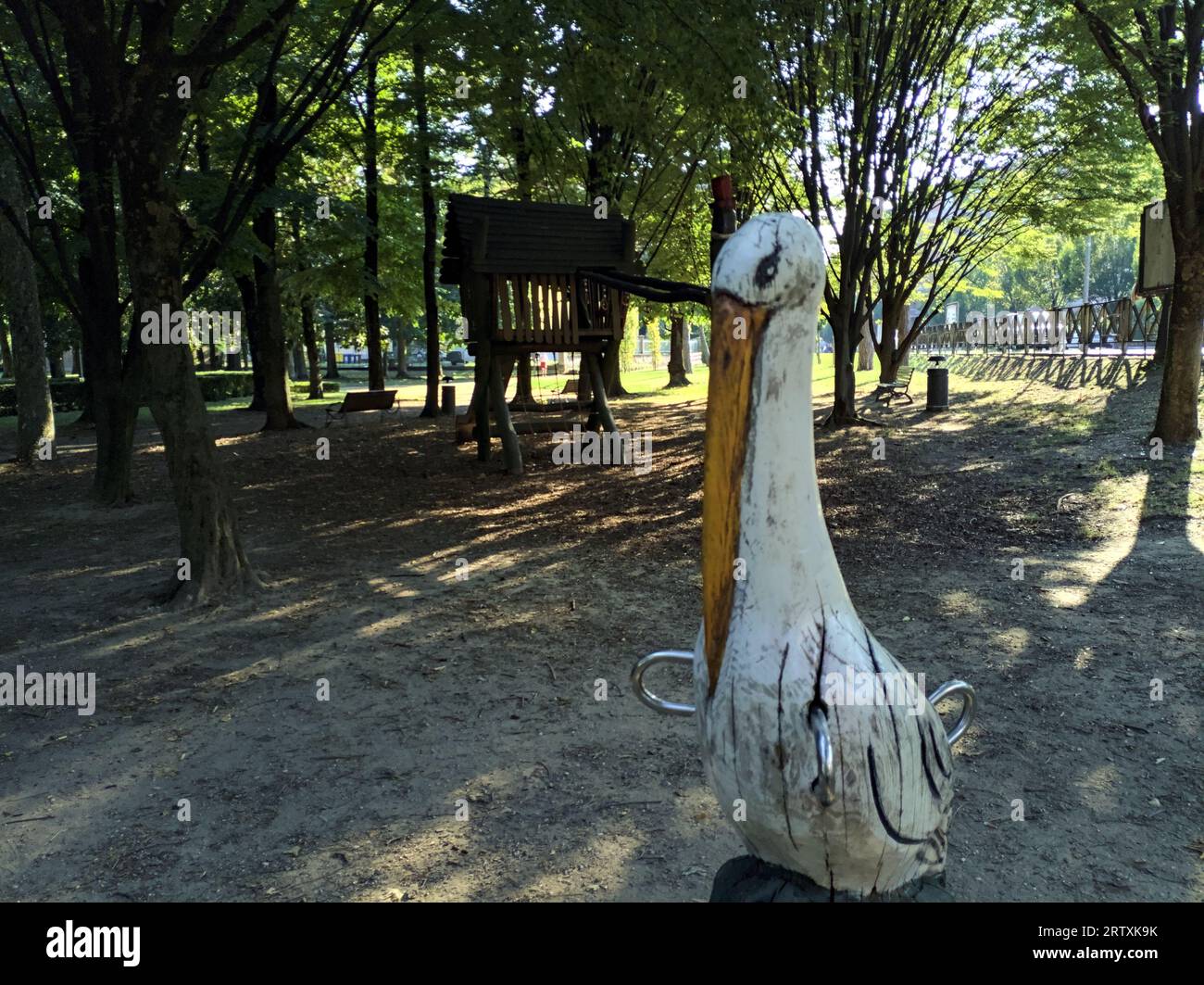 Swing in a playground summer a swing hanging seat hi-res stock ...
