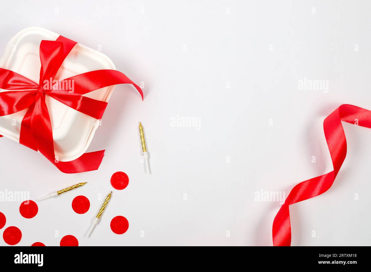 Closed bento cake box with tied red ribbon. Gift box with tasty bento ...