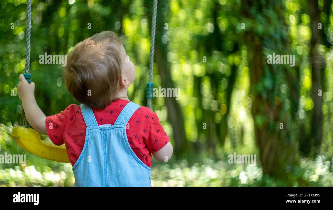 Kid looking at the sky Stock Photo - Alamy