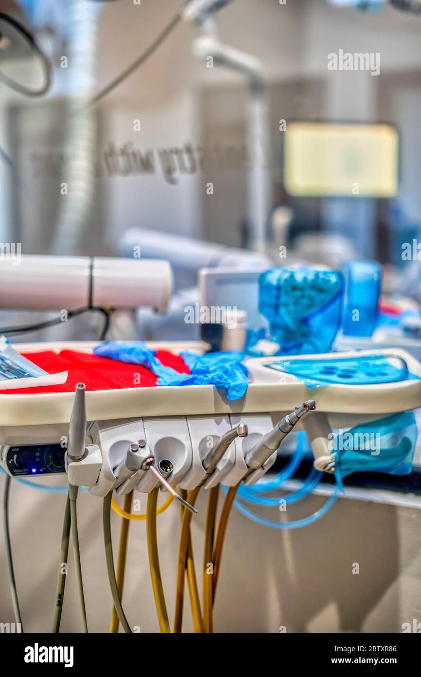 Two operating room chairs positioned in front of a hospital bed with an ...
