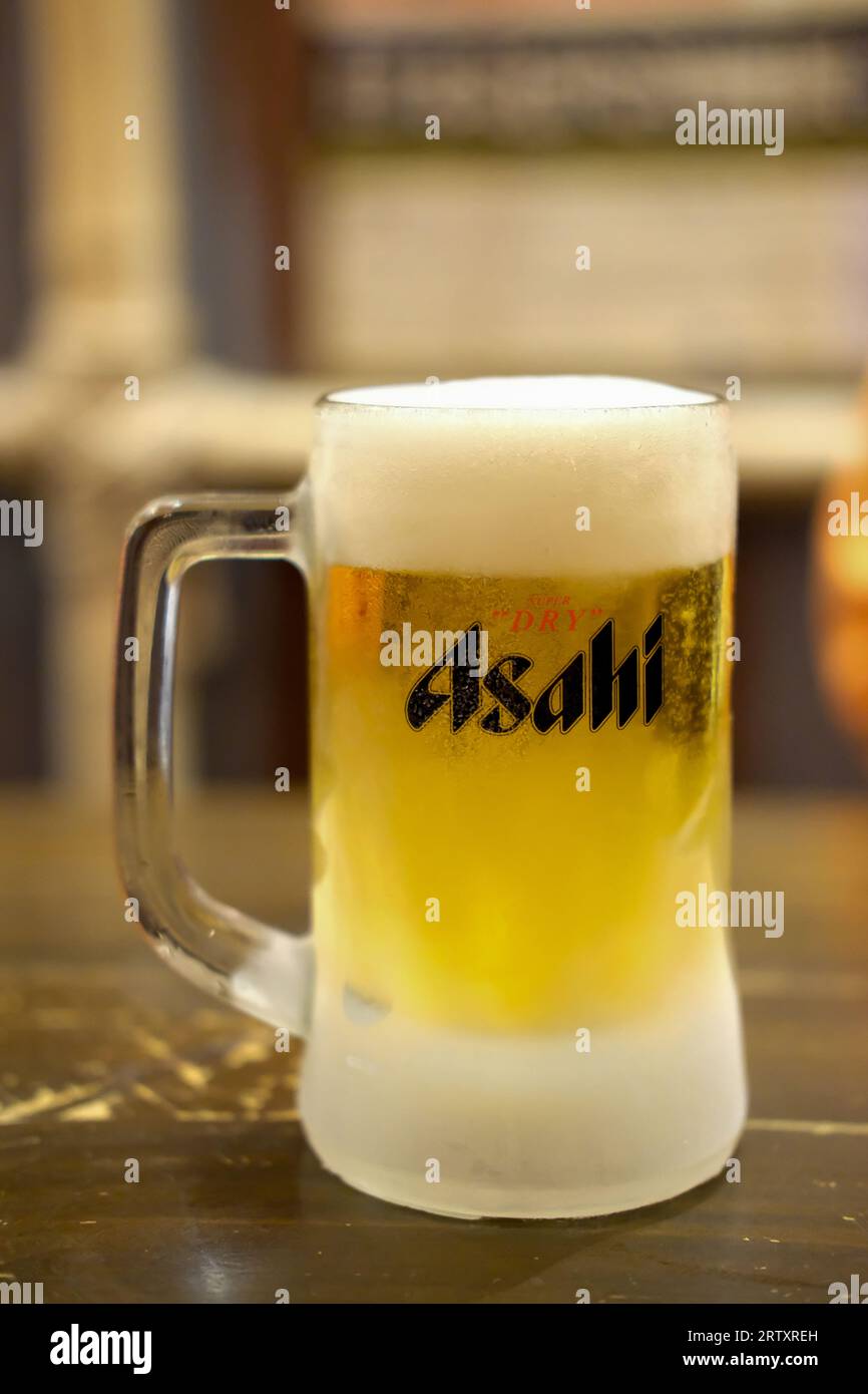 Bangkok, Thailand - 11 December 2021: A mug of Asahi, a Japanese rice ...