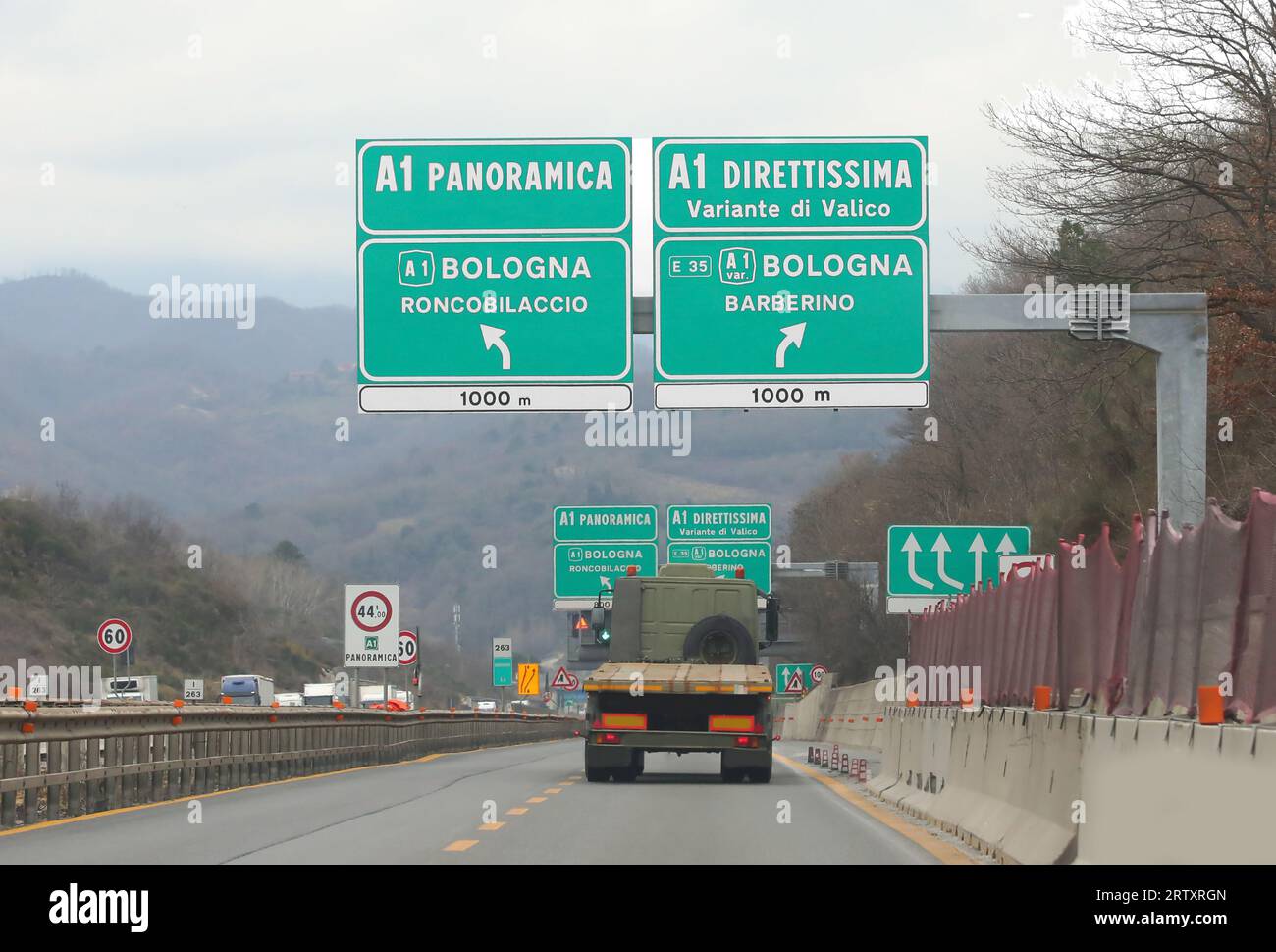 wide road sign in the italian motorway with place of city and two way ...