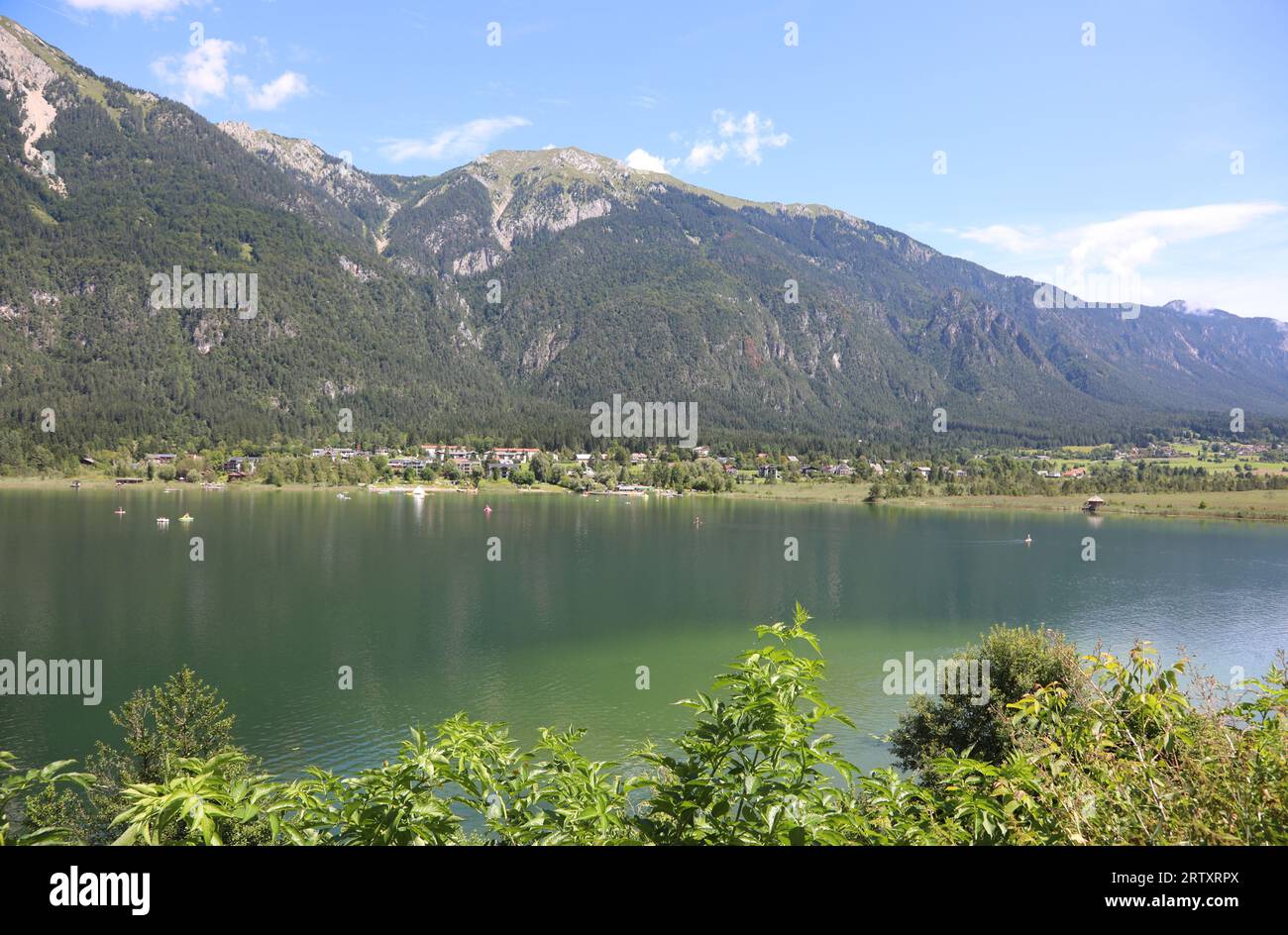 Alpine lake called PRESSEGGER SEE and the Alps mountain range in the ...