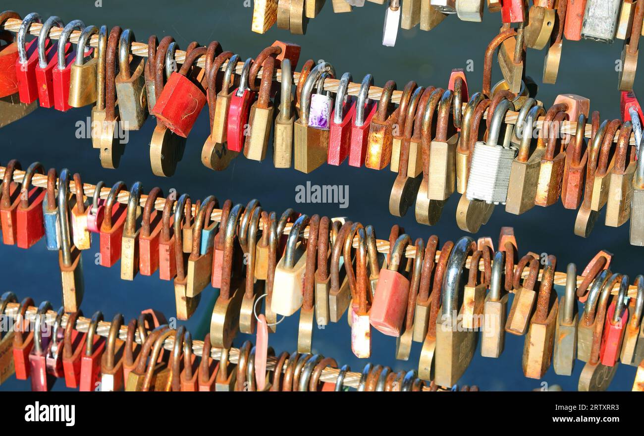 many Padlocks hanging from the growling of the Bridge by lovers symbol ...