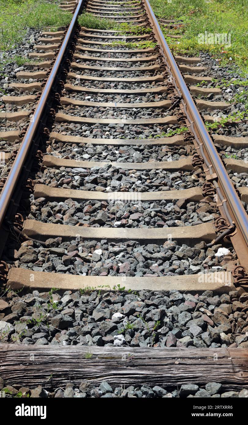 long iron train rail tracks to infinity with no people vertically Stock ...