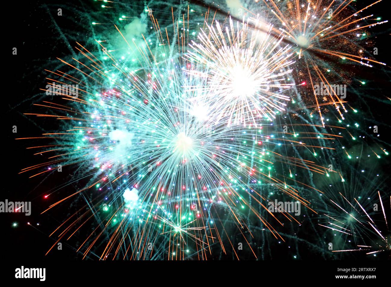 colorful fiery sparks from huge fireworks during night celebrations ...