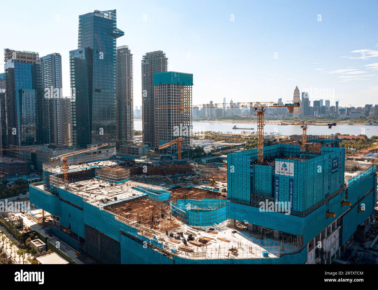 An aerial view of a bustling cityscape with towering high-rise ...