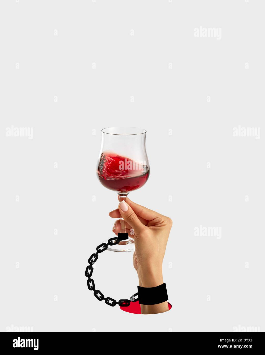 Female hand with chain connected to wine. glass. Conceptual design ...